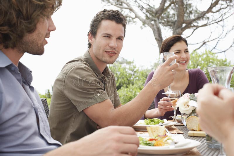 Happy Friends Enjoying Dinner Stock Image - Image of enjoying, lunch ...