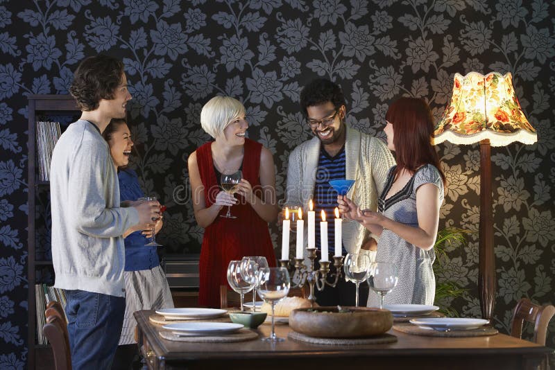 Friends Enjoying Drinks by Dining Table Stock Image - Image of leisure ...