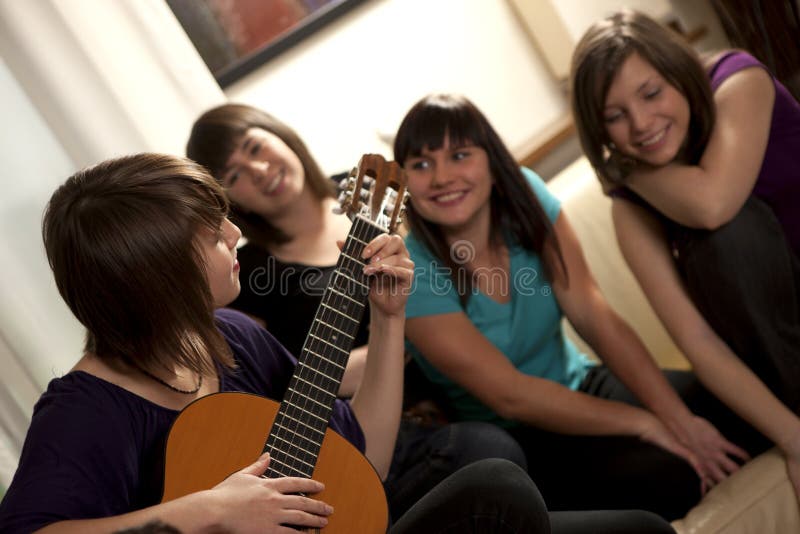 Friends enjoys music stock image. Image of community - 16983703