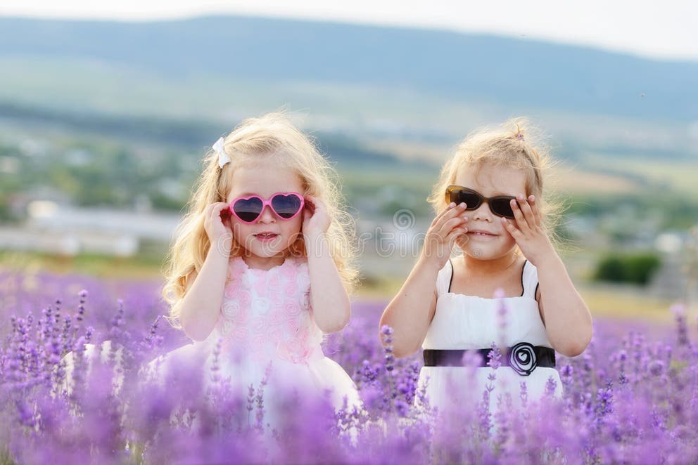 Friends in field stock photo. Image of friend, adorable - 46284792