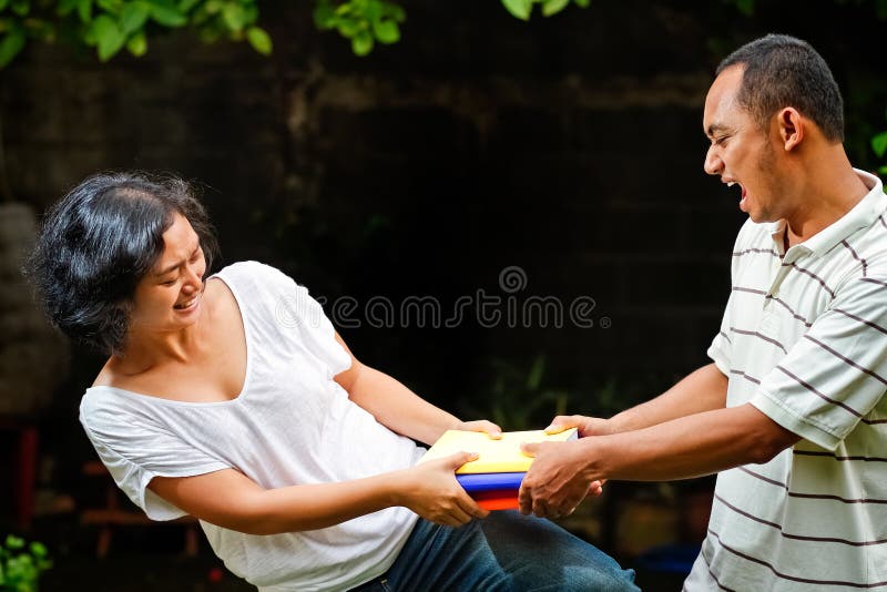 Friends fight for books stock image. Image of couples - 23982983