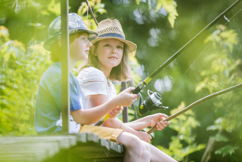 Friends Fishing while Sitting on Pier Stock Photo - Image of enjoyment ...