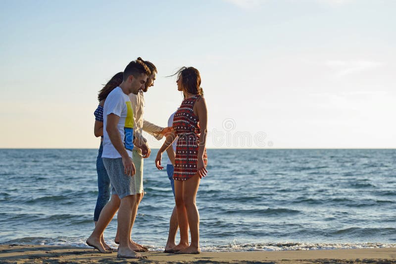 Friends Fun on the Beach Under Sunset Sunlight. Stock Photo - Image of ...