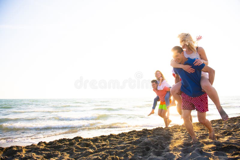 Friends Fun on the Beach Under Sunset Sunlight Stock Image - Image of ...