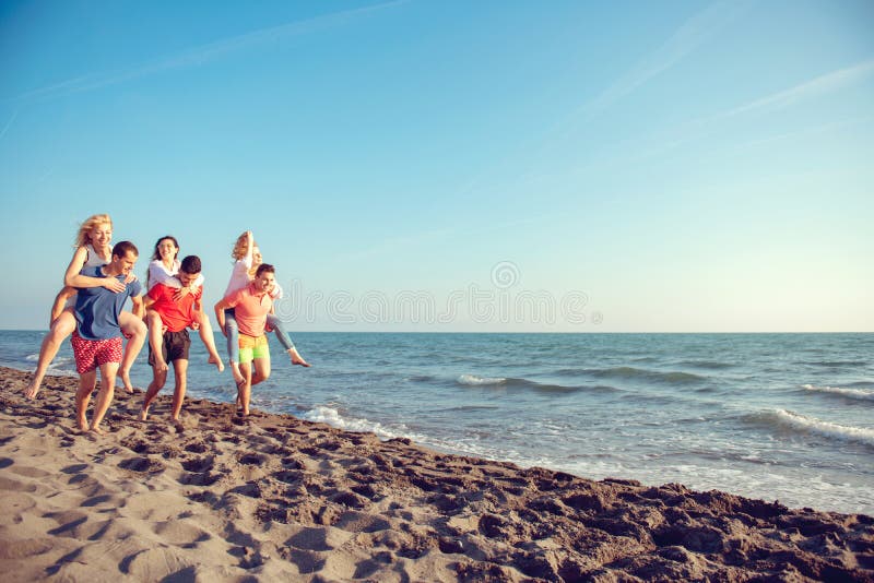 Friends Fun on the Beach Under Sunset Sunlight Stock Photo - Image of ...