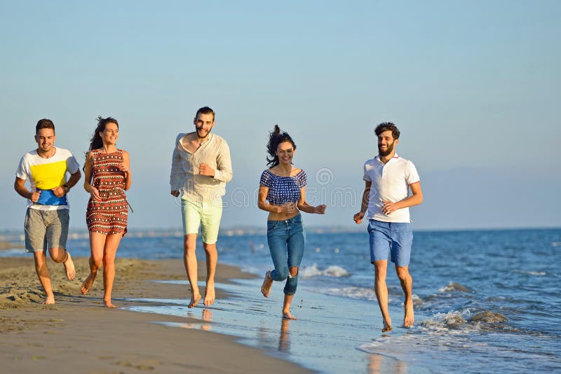 Friends Fun on the Beach Under Sunset Sunlight. Stock Photo - Image of ...