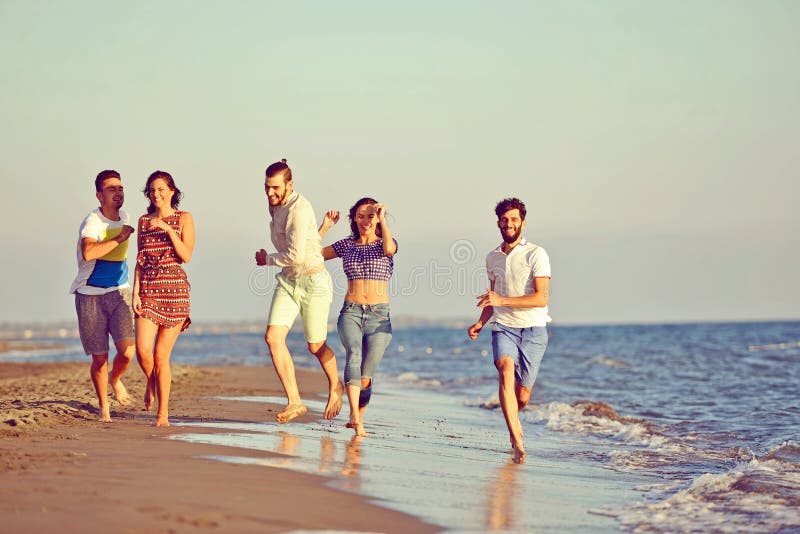 Friends Fun on the Beach Under Sunset Sunlight. Stock Image - Image of ...