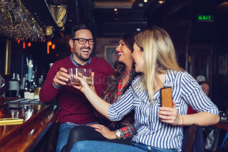 Friends Got Together after Work in a Bar for a Few Drinks. - Image ...