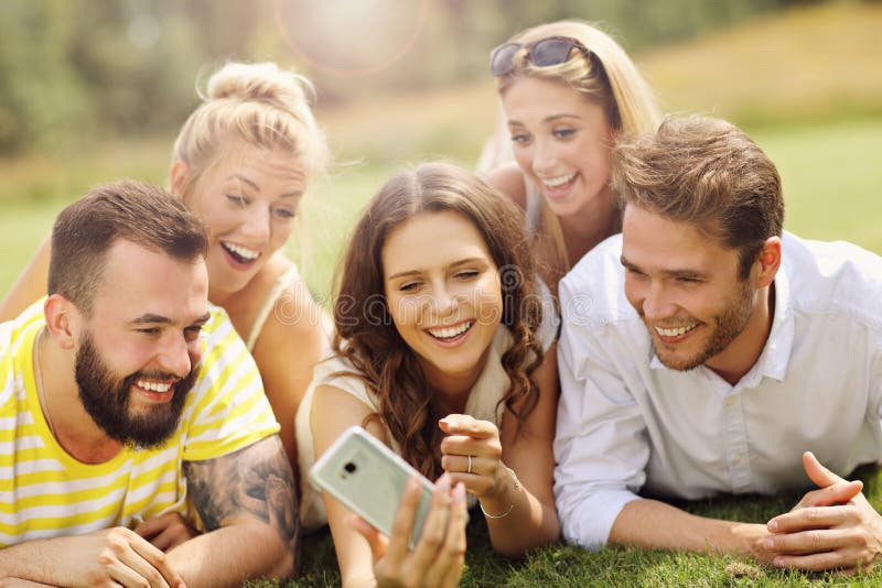 Friends Group Having Fun Together on Grass Stock Image - Image of ...