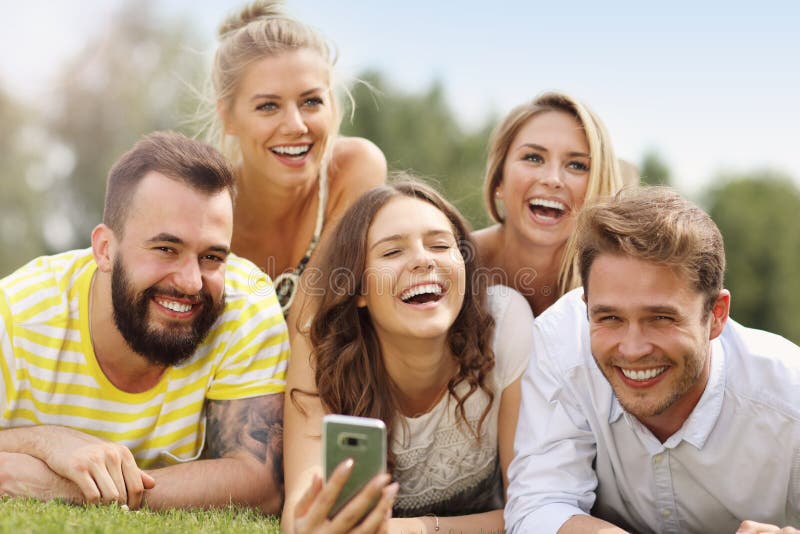 Friends Group Having Fun Together on Grass Stock Image - Image of party ...