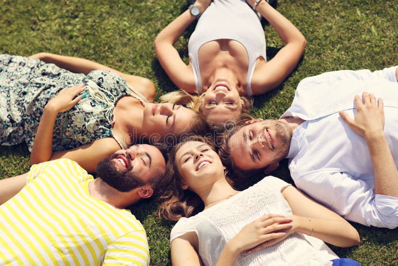 Friends Group Having Fun Together on Grass Stock Image - Image of ...