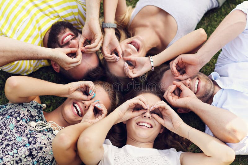 Friends Group Having Fun Together on Grass Stock Image - Image of ...