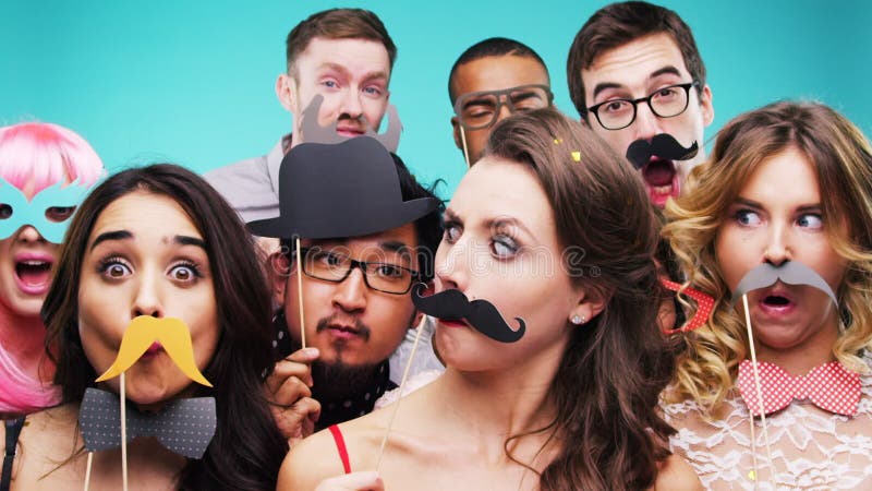 Friends, Group and Party in Studio for Celebration in Photobooth with ...