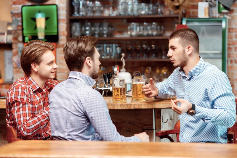 Friends Have a Beer at the Pub Stock Image - Image of casual, business ...