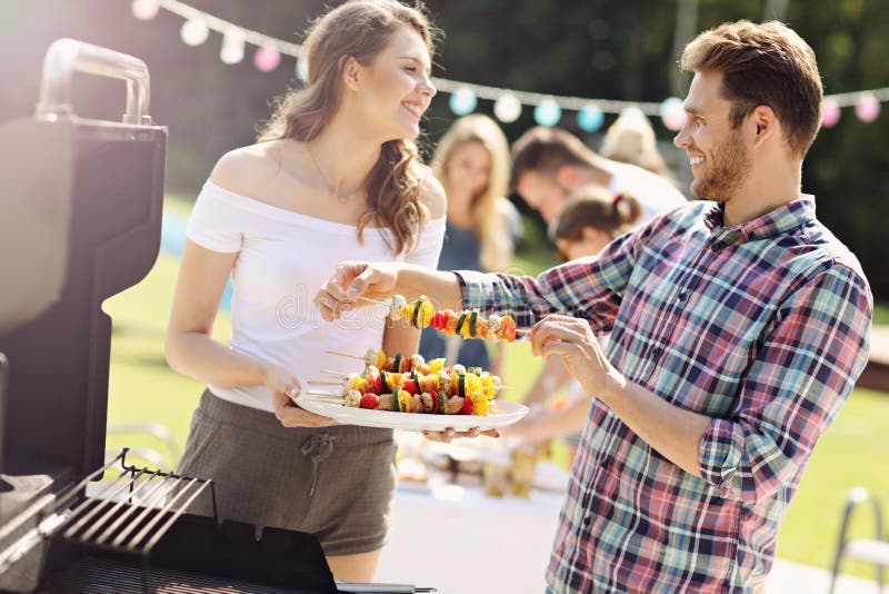 Friends Having Barbecue Party in Backyard Stock Photo - Image of ...