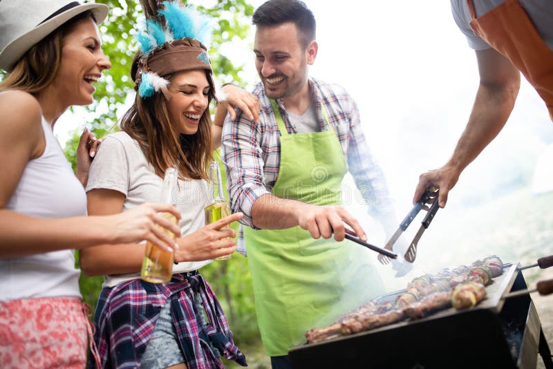 Friends Having a Barbecue Party and Fun in Nature Stock Image - Image ...