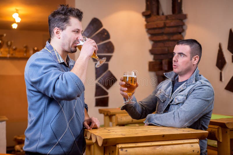 Friends Having Beers in Pub Stock Photo - Image of horizontal, chat ...