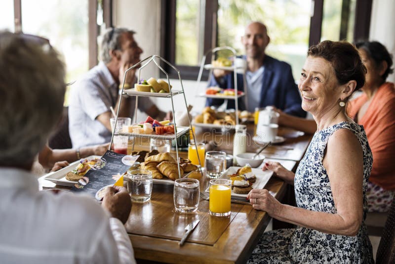 Friends Having Breakfast at a Hotel Stock Photo - Image of food ...