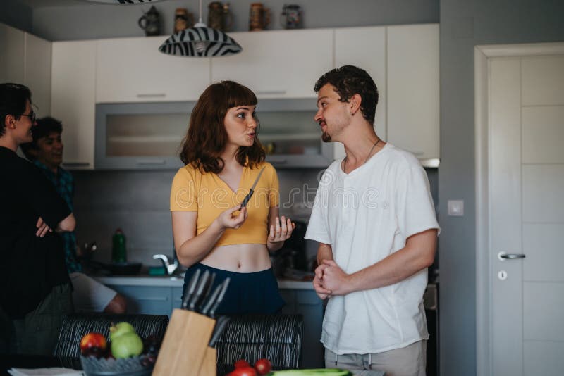 Friends Having a Casual Conversation in a Modern Kitchen Stock Image ...