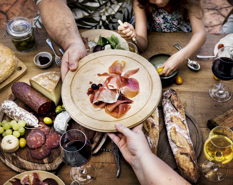 Friends Having Cold Cuts and Wine for Dinner Stock Photo - Image of ...