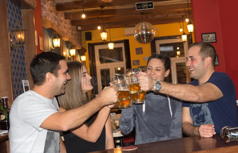 Friends Having Drinks in a Bar Stock Image - Image of couple, females ...
