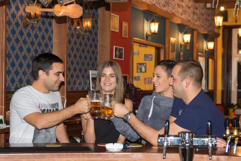 Friends Having Drinks in a Bar Stock Image - Image of counter ...