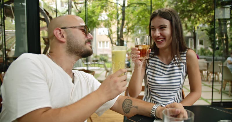 Friends Having Drinks and Talking at a Cafe Stock Video - Video of ...