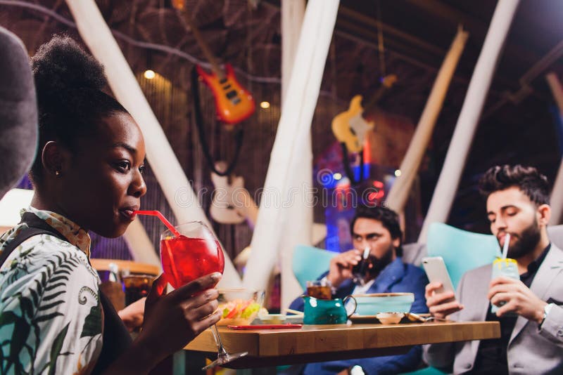 Friends Having Fun at the Bar Outdoors, Drinking Cocktails. Stock Image ...