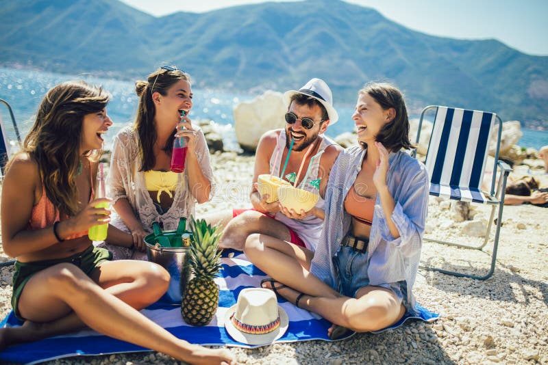 Friends Having Fun at the Beach on a Sunny Day. Party Time Stock Image ...