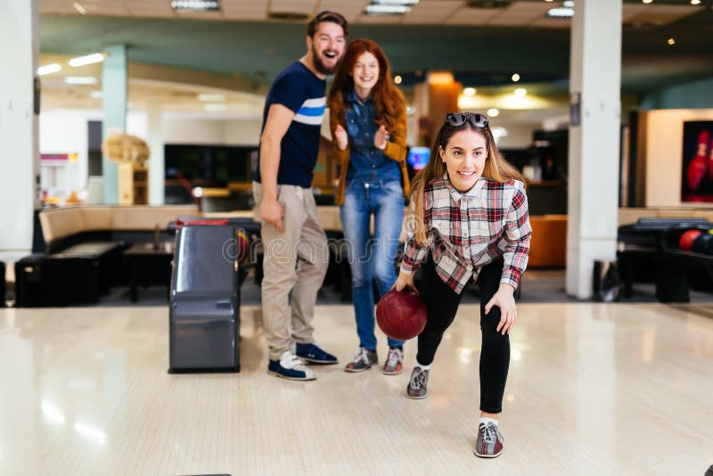 Friends Having Fun while Bowling Stock Photo - Image of friends ...