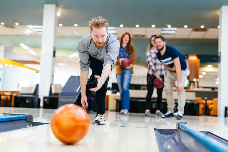 Friends Having Fun while Bowling Stock Photo - Image of friends, group ...