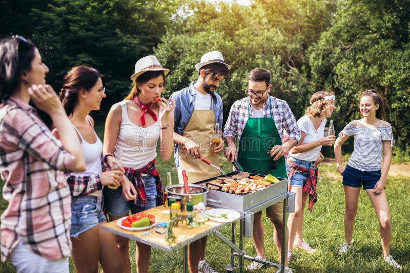 Friends Grilling Meat Enjoying Bbq Party Stock Photo - Image of dinner ...