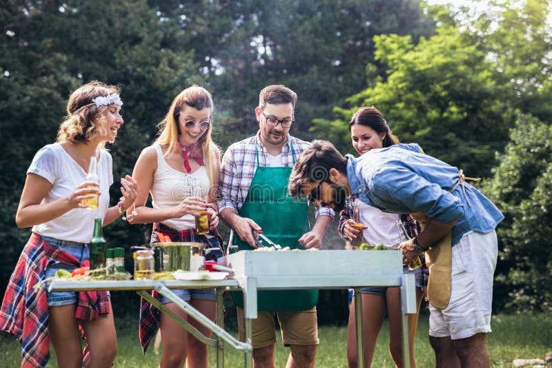 Friends Having Fun Grilling Meat Enjoying Bbq Party Stock Image - Image ...