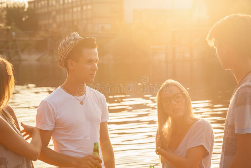 Friends Having Fun Near Lake Stock Photo - Image of food, male: 45196324