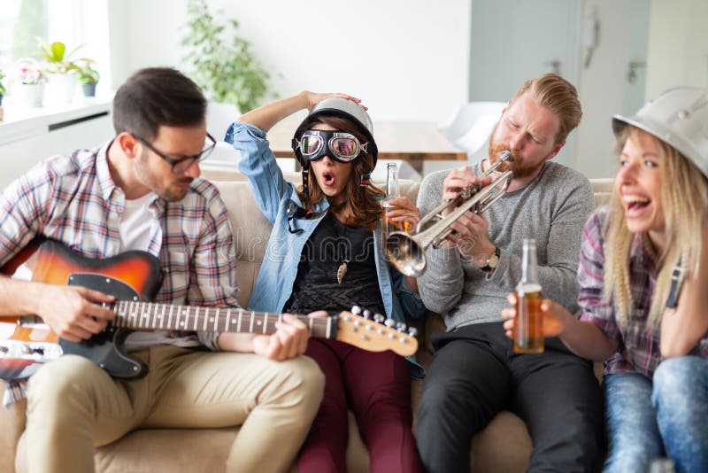 Friends Having Fun and Partying in House and Playing Music Stock Image ...