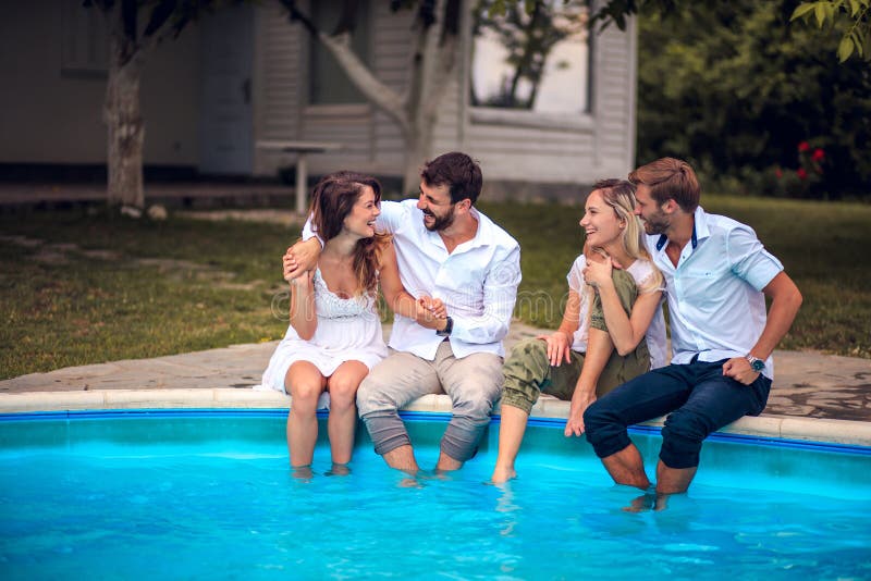 Friends Having Fun by the Pool Stock Photo - Image of activity ...