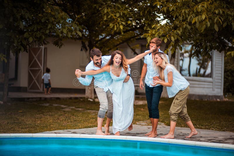 Friends Having Fun by the Pool Stock Image - Image of active, middle ...