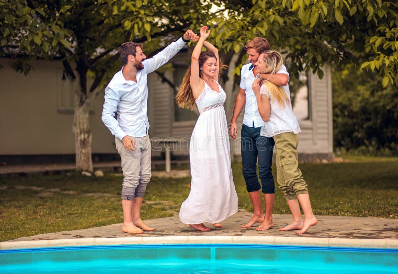 Family sitting by the pool stock image. Image of cheerful - 219520271
