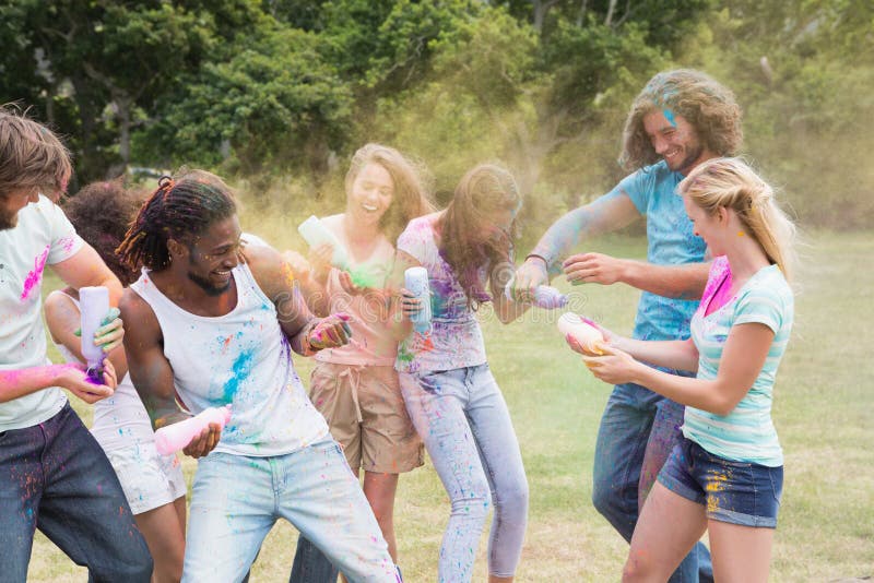 Friends Having Fun with Powder Paint Stock Photo - Image of lawn, calm ...