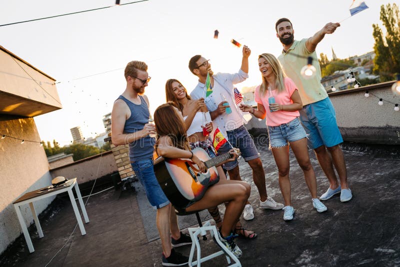 Friends Having Fun at Rooftop Party. Stock Image - Image of friends ...