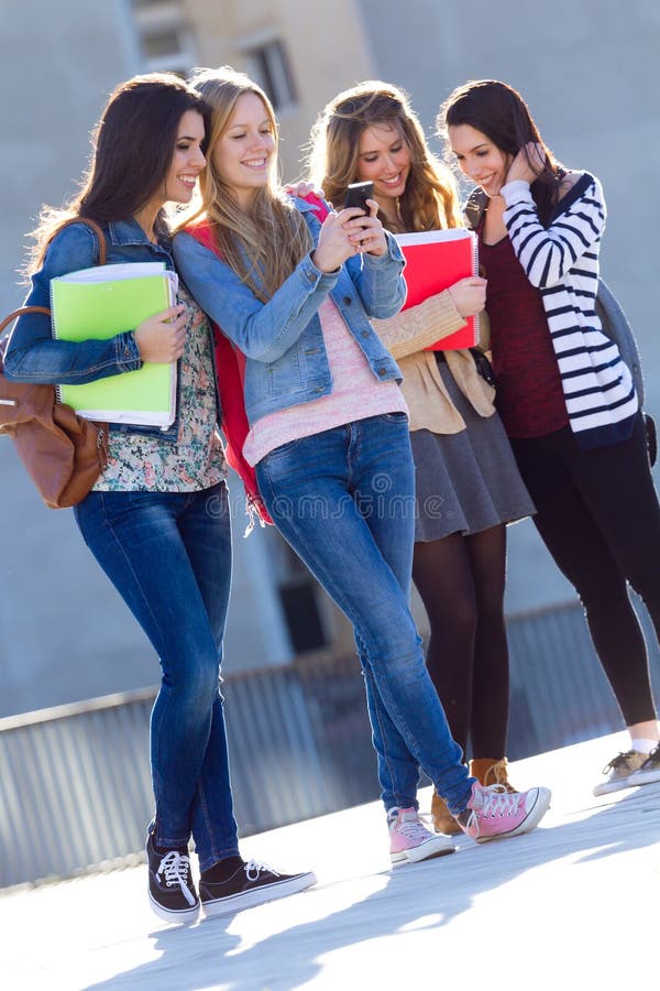 Friends Having Fun with Smartphones Stock Image - Image of attractive ...