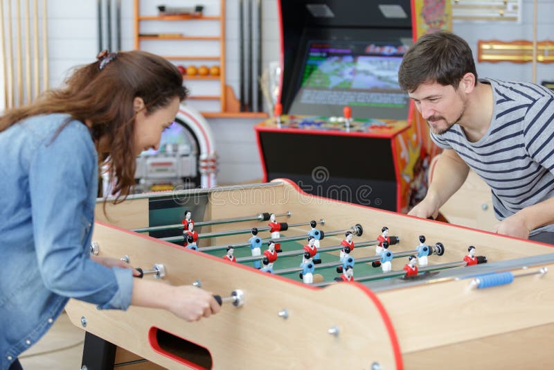 Friends Having Fun Together Playing Table Football Stock Image - Image ...
