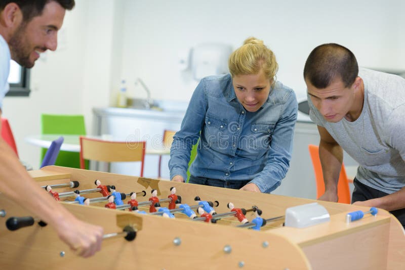 Friends Having Fun Together Playing Table Football Stock Image - Image ...