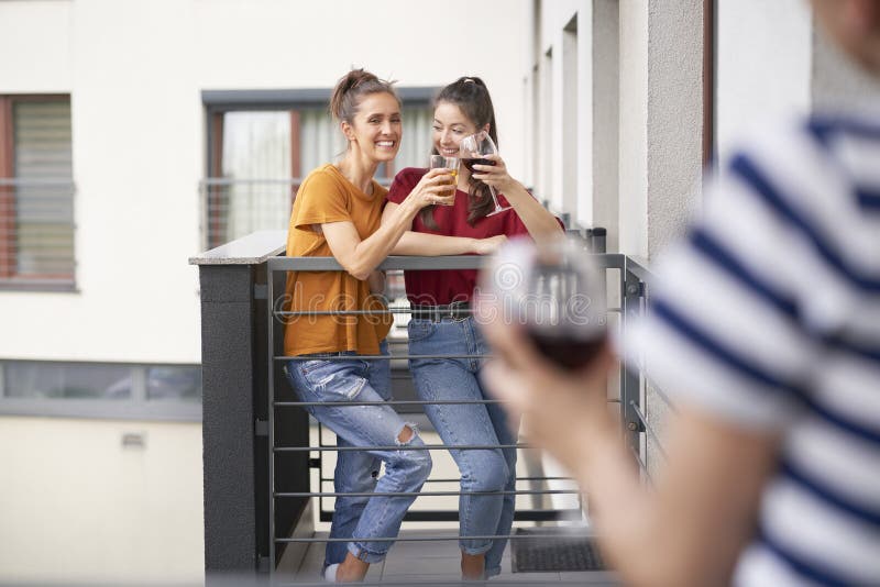Friends Having Home Party on Balcony Stock Photo - Image of toast ...
