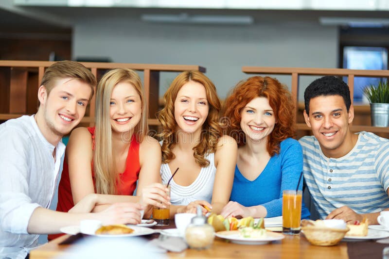 Friends having lunch stock image. Image of enjoyment - 65007837