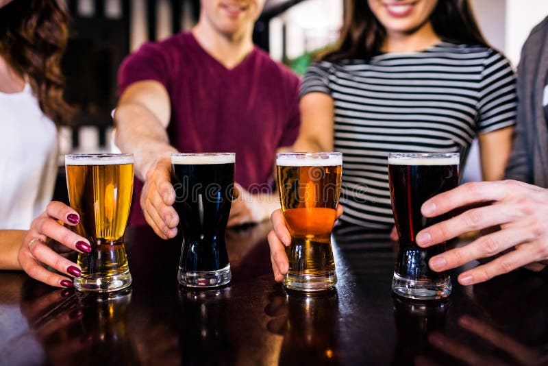 Friends having a pint stock photo. Image of caucasian - 66148204