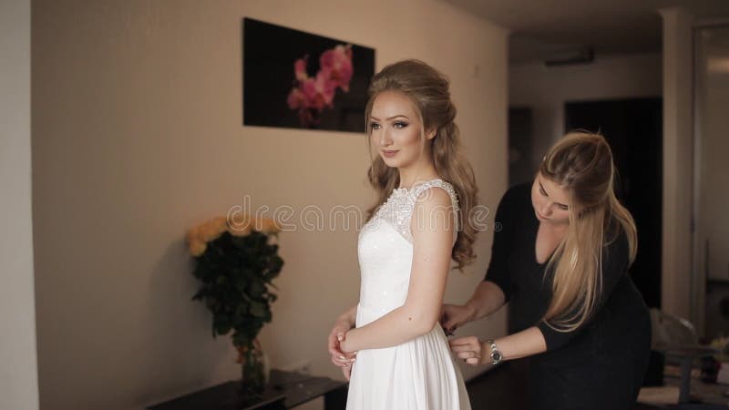 Friends Helping Bride Get into Dress Stock Video - Video of indoors ...