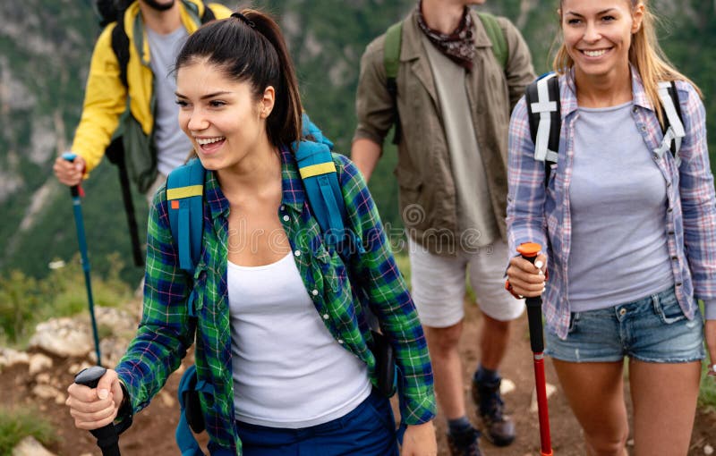 Group of Friends Hiking Together Outdoors Exploring the Wilderness and ...