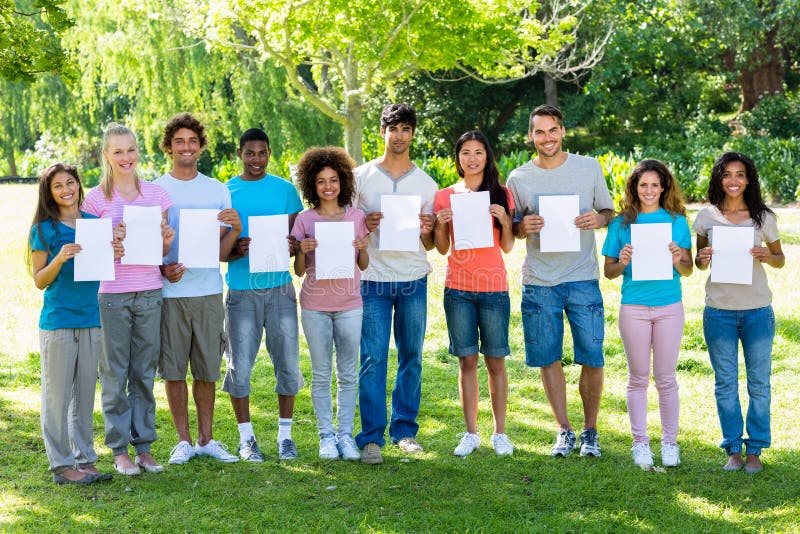 Friends Holding Blank Papers in Park Stock Image - Image of full ...