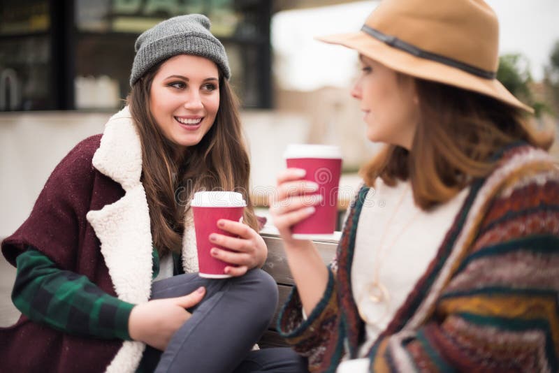 Friends with hot drink stock image. Image of smile, shopping - 67495729